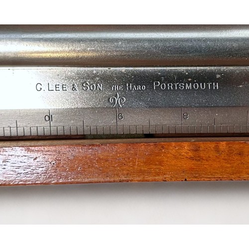 A stainless steel parallel rolling ruler in fitted box, stamped G. Lee ...