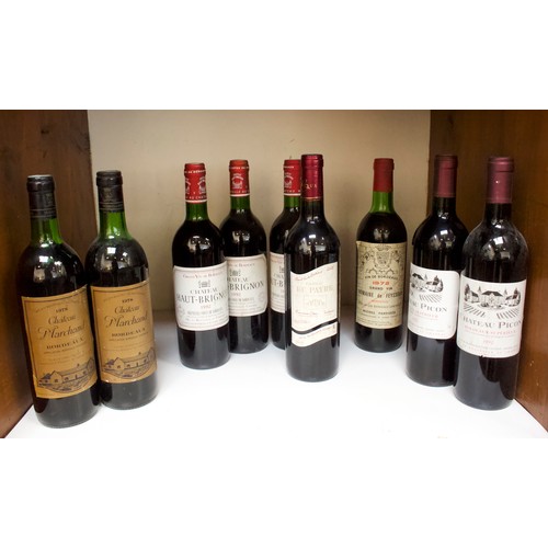 A collection of nine bottles of assorted vintage red wine, comprising ...