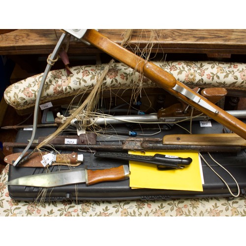 A collection of assorted weaponry, including a cased Samick Archery bow ...