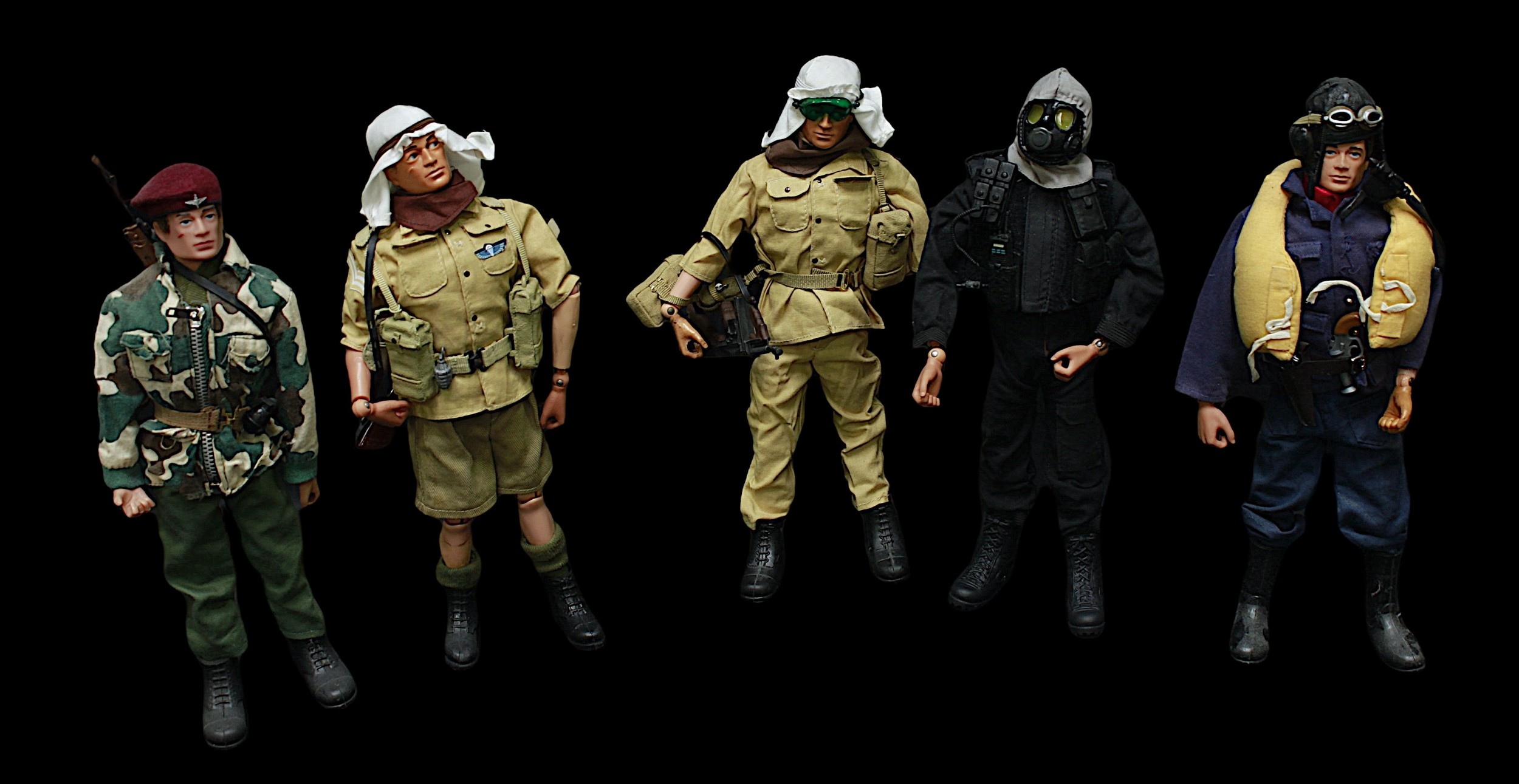 A group of five Palitoy Action Man flock hair military figures, dressed ...
