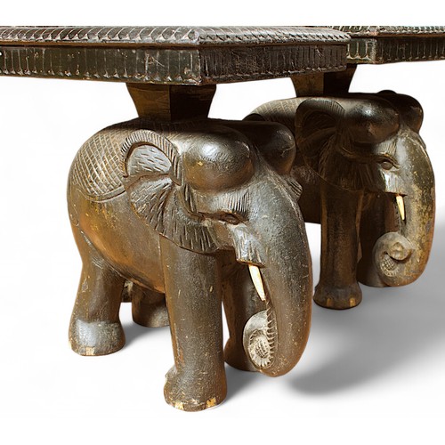 An Anglo-Indian hardwood table, the top decorated with leaf moulded ...