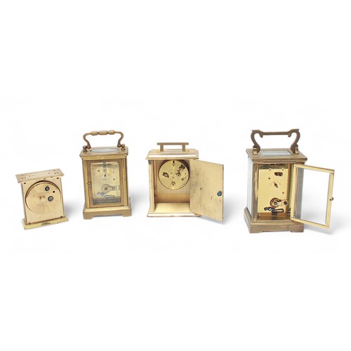 A collection of four brass cased carriage clocks, two with white enamel ...