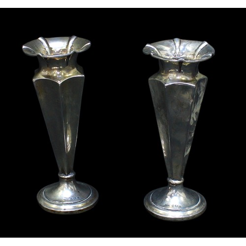 A small collection of assorted silver items including a pair of spill ...