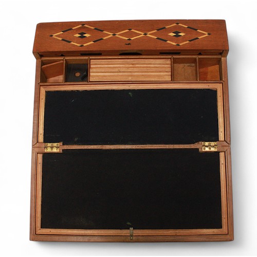 A late 19th Century mahogany and parquetry writing slope, with black ...