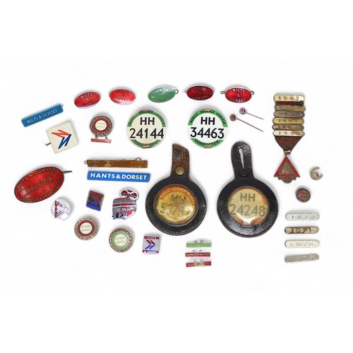 A collection of assorted bus related badges including an enamel Wilts ...