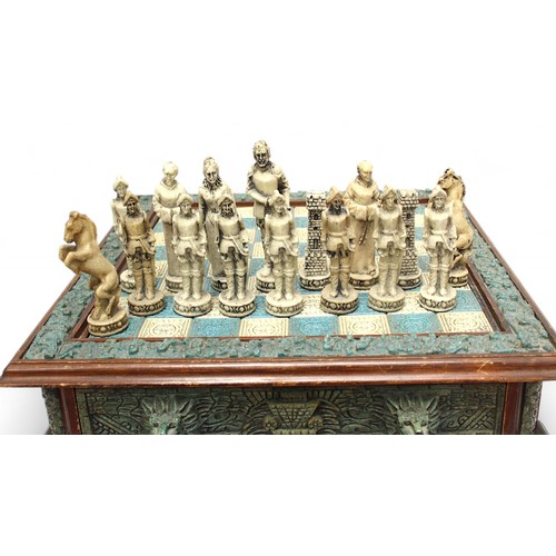 An unusual large scale Aztec chess set, comprising resin figures and an ...