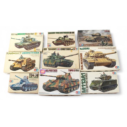 A collection of nine boxed Tamiya 1:35 scale plastic model tanks and ...