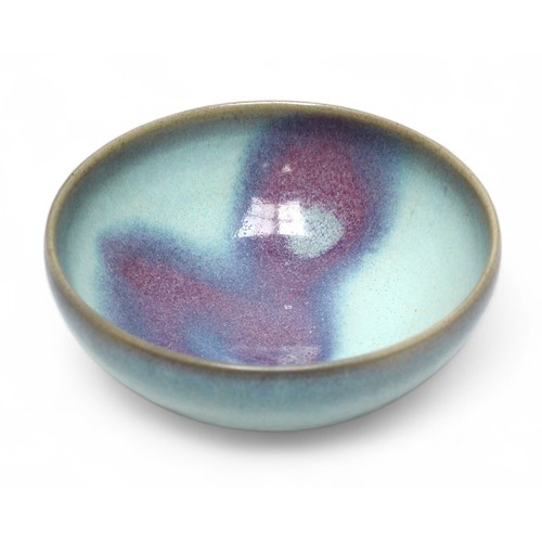 A Chinese Jun ware pottery bowl, the opalescent sky blue glaze with ...