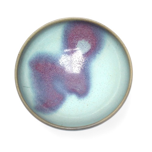 A Chinese Jun ware pottery bowl, the opalescent sky blue glaze with ...