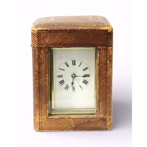 A French brass carriage clock, the white enamel dial with Roman ...