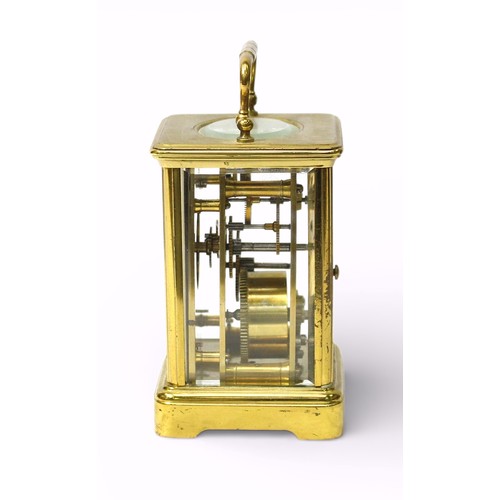 A French brass carriage clock, the white enamel dial with Roman ...