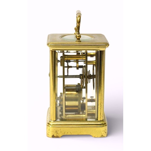 A French brass carriage clock, the white enamel dial with Roman ...