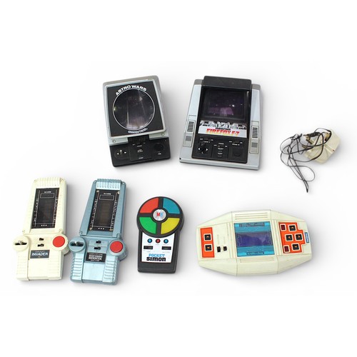 A collection of vintage electronic games consoles, comprising ...