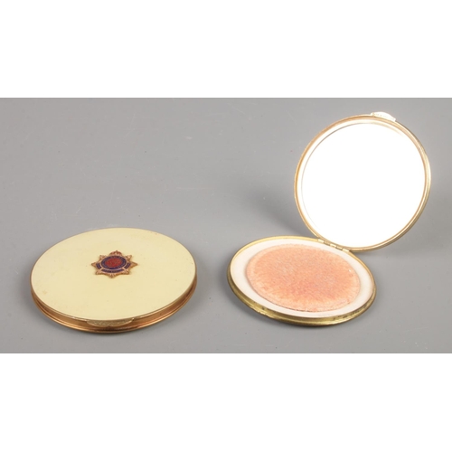 Two powder compacts bearing Royal Army Service Corps. badges, one ...