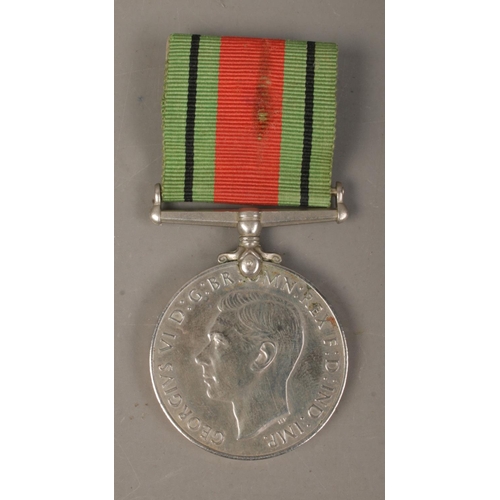 A WWII Defence Medal awarded to F.W Hallums, Homeguard with ...