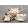A 19th century Rockingham tea cup and saucer together with a similar ...