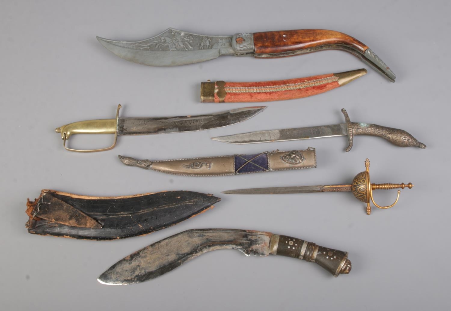 A collection of knives and daggers to include Kukri knife, Eastern ...