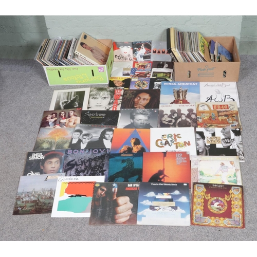 Two large boxes of mixed singles and vinyl records, primarily rock and ...