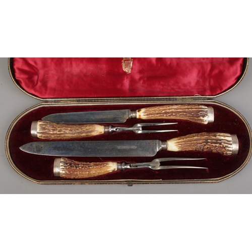 A cased four piece Wade Wingfield and Rowbotham carving set, with horn ...