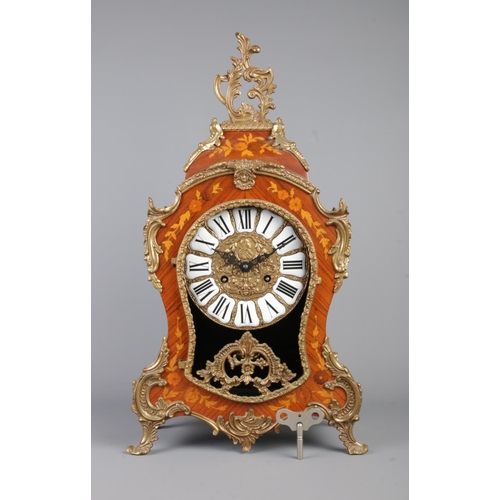 A French style marquetry inlaid bracket clock. With gilt metal mounts ...