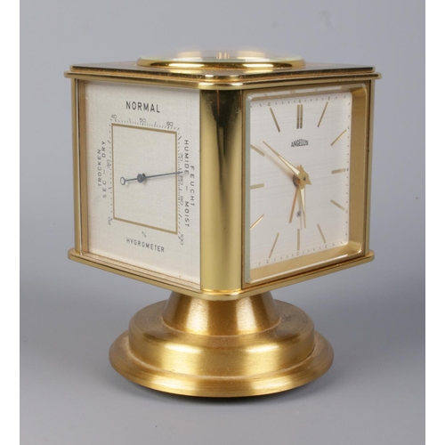 A vintage brass Angelus desk clock/weather station. Having rotating ...