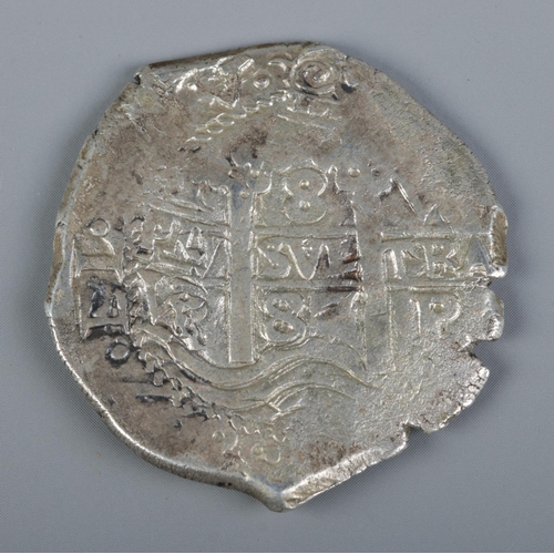 A Spanish 'Piece of Eight' 8 reales coin recovered from the wreckage of ...