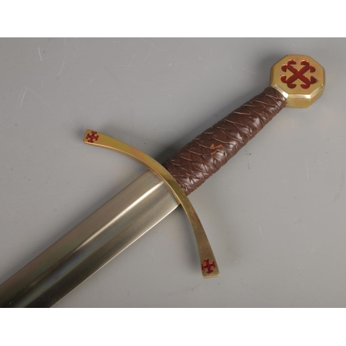 A modern reproduction Knights Templar sword. Blade length: 78cm. CANNOT ...