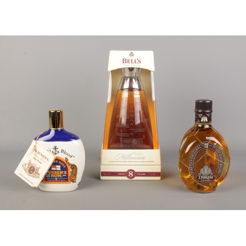 Three full and sealed bottles of alcohol. Consisting of Bells ...