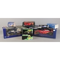 A collection of boxed diecast Formula One racing cars. Includes ...