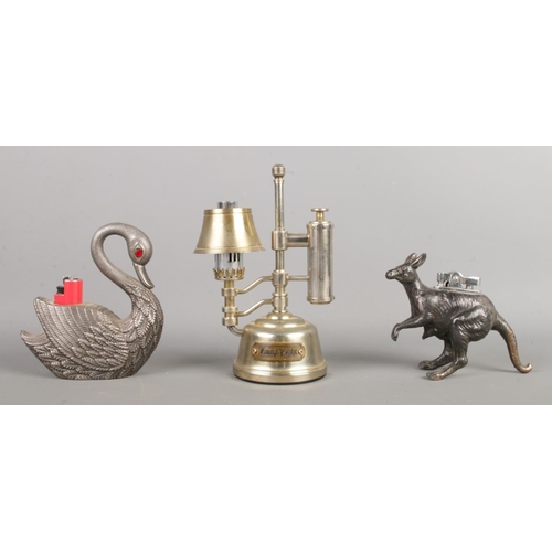 Six vintage lighters, comprising a Japanese lamp lighter, two animal ...