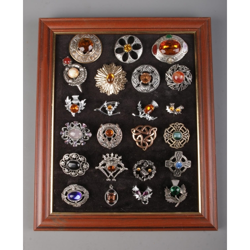 A tray of Scottish and Celtic style brooches and pendants, to include ...