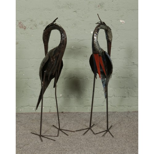 A pair of garden sculptures in the form of herons, handmade using ...