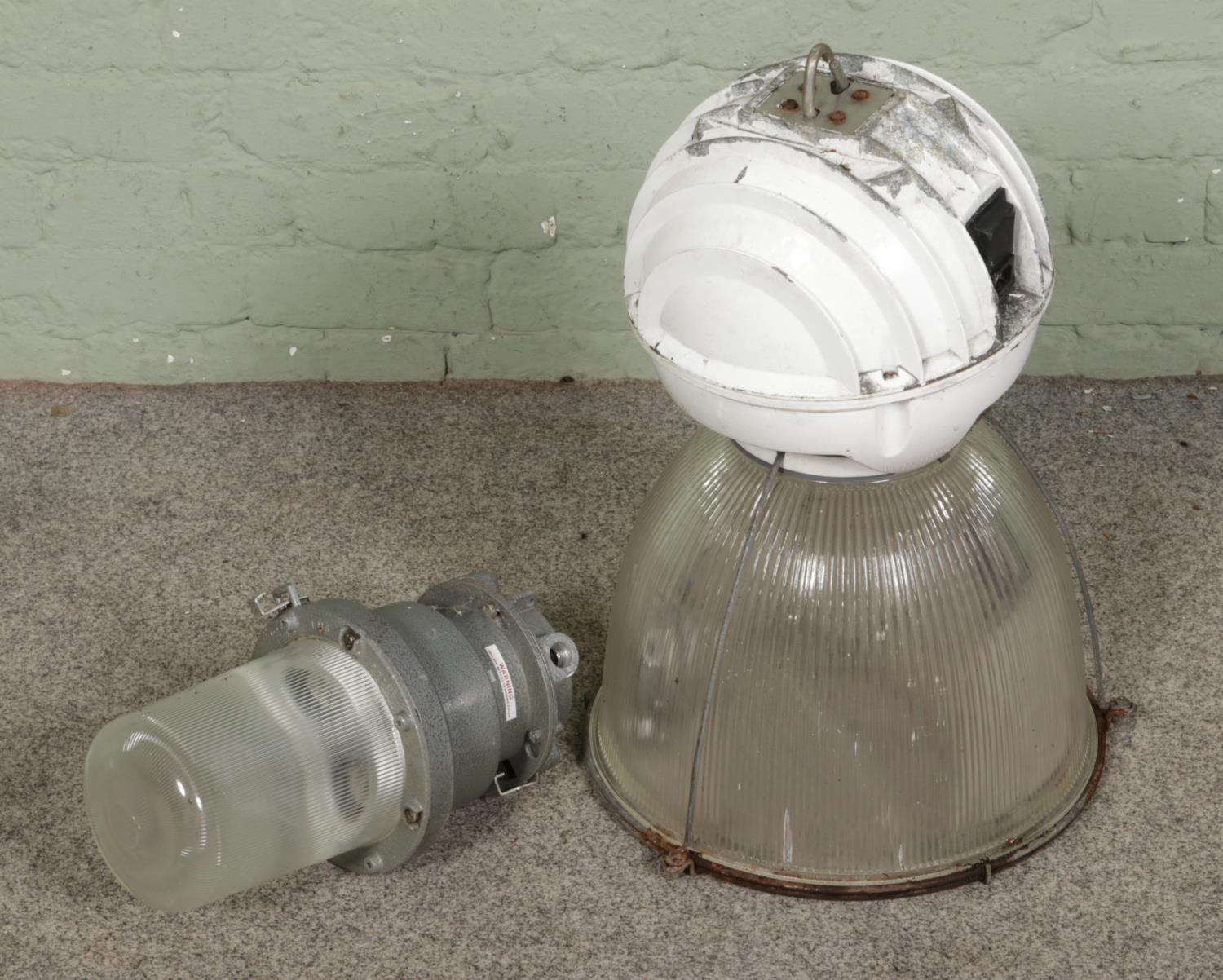 Two industrial ceiling lights including a Holophane Lighting and ...