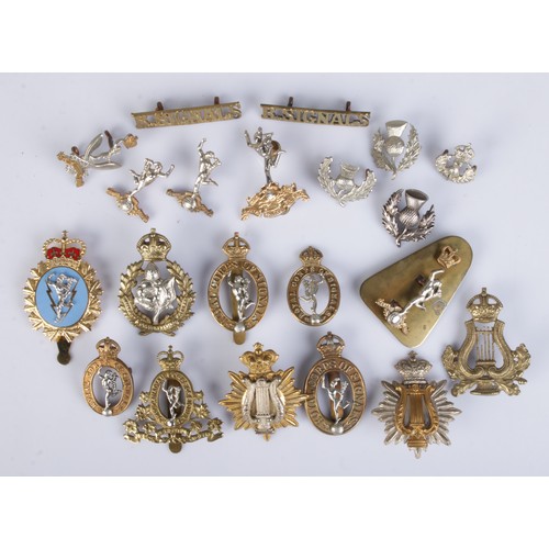 A collection of military cap badges/shoulder titles; Royal Corps Of ...