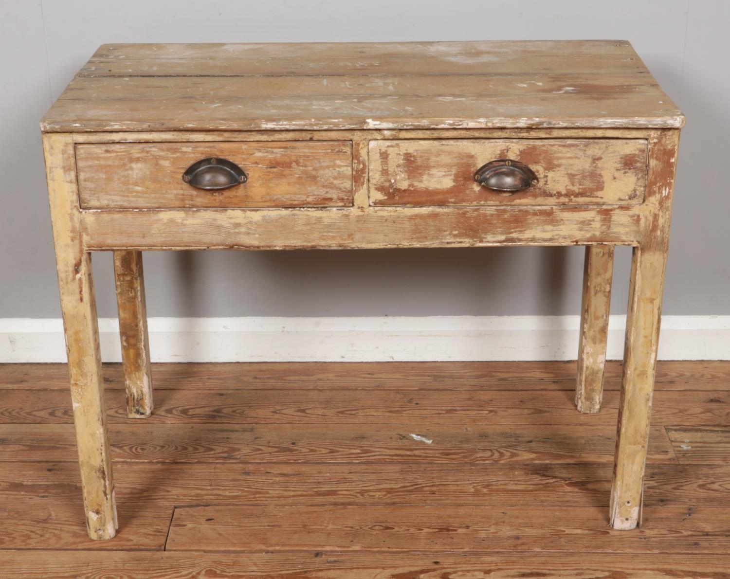 A vintage desk/side table featuring two drawers with cup handles ...