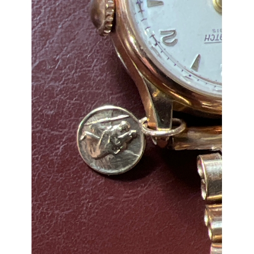 Ladies rolled gold watch with 9 carat gold st Christopher