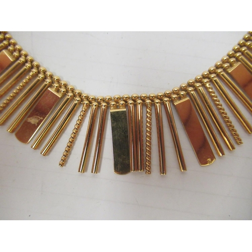 An 18ct gold rod, pendant and tab design necklace, on a bayonet clasp
