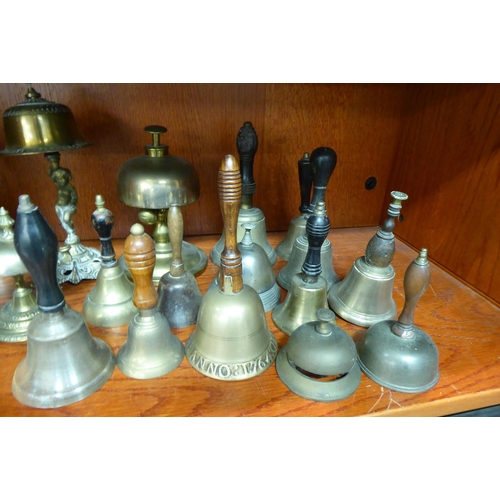 Victorian and later brass hand and counter bells, most on turned ...
