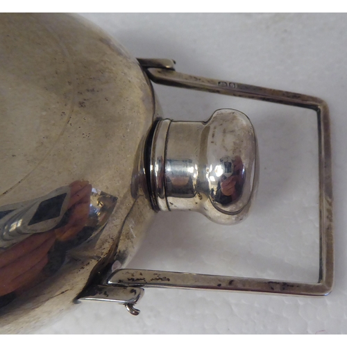 A late Victorian silver spirit flask of bun design with a threaded cap ...
