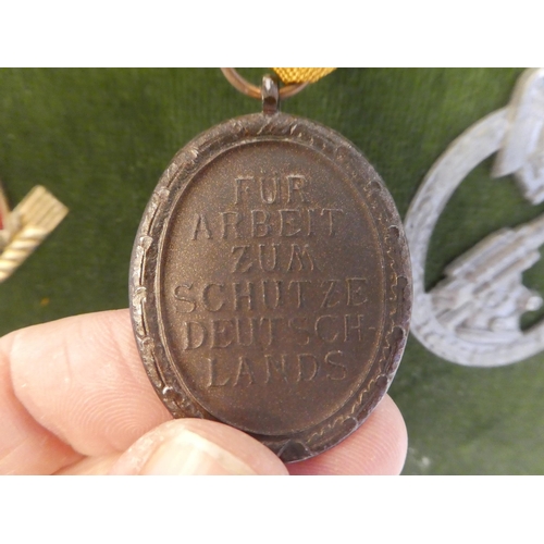 A display of German World War II era military badges, some copies: to ...