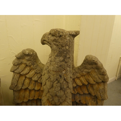 A pair of late 1950s composition stone grotesque birds on separate ...