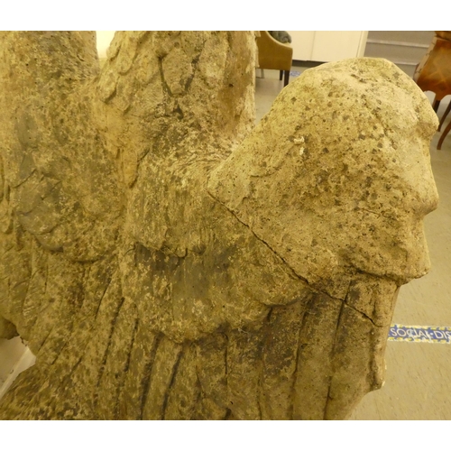 A pair of late 1950s composition stone grotesque birds on separate ...