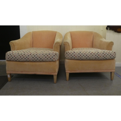 A pair of Pearson arm chairs, upholstered in peach coloured and star ...