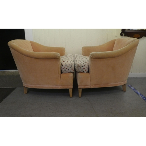 A pair of Pearson arm chairs, upholstered in peach coloured and star ...