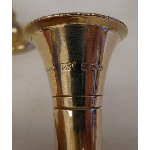 Four similar loaded silver trumpet design specimen vases with serrated ...