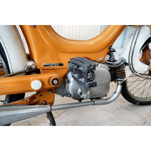 A 1975 Honda 49cc moped in orange and white livery, original ...