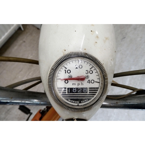 A 1975 Honda 49cc moped in orange and white livery, original ...