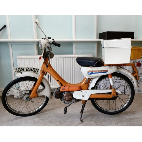 A 1975 Honda 49cc moped in orange and white livery, original ...