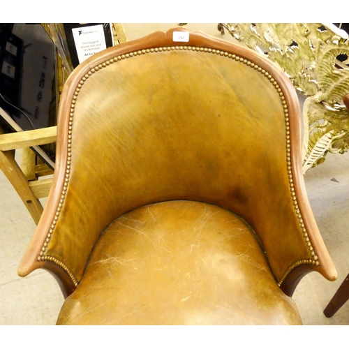 A 1930s mahogany showwood framed desk chair, stud upholstered in green ...