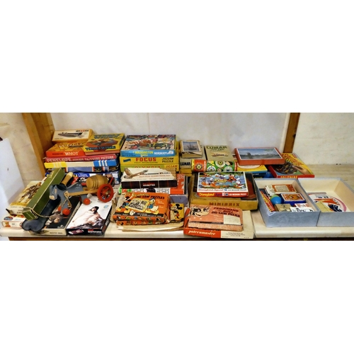 An early 20thC cast metal trunk, containing period puzzles and games 11 ...